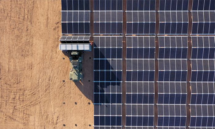 Hinged, folding solar array for rapid deployment at industrial scale