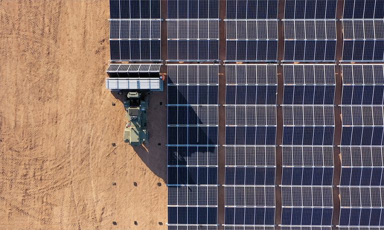 Hinged, folding solar array for rapid deployment at industrial scale