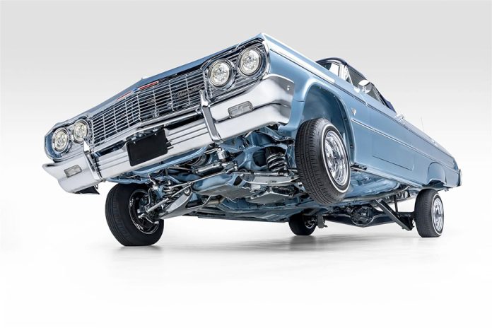 Custom 1964 Chevrolet Impala Convertible Lowrider tilts on three wheels