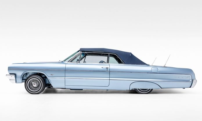 Custom 1964 Chevrolet Impala Convertible Lowrider tilts on three wheels