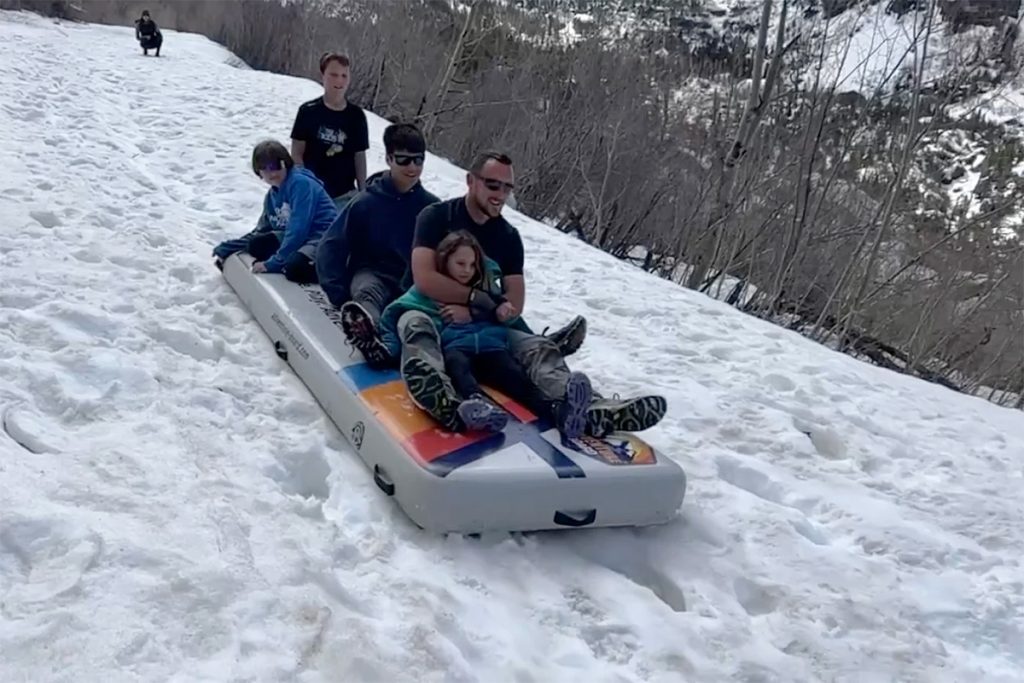 All-terrain inflatable fun board designed to bounce, propel, float and sled