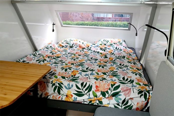 Aero Cabin camping trailer features a pop-up roof and slide-out front