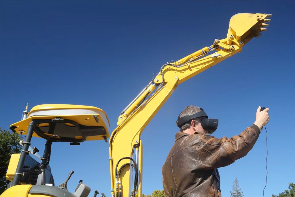 Robot excavator operates with a wave, a wireless joystick, or pure ...