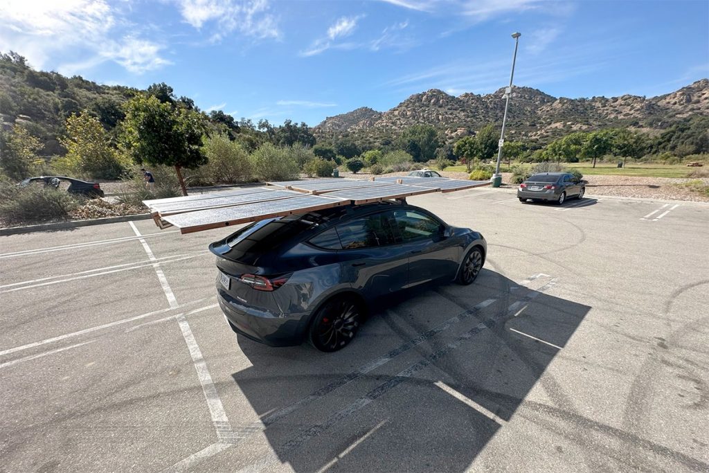 Folding rooftop solar array to self charge your EV