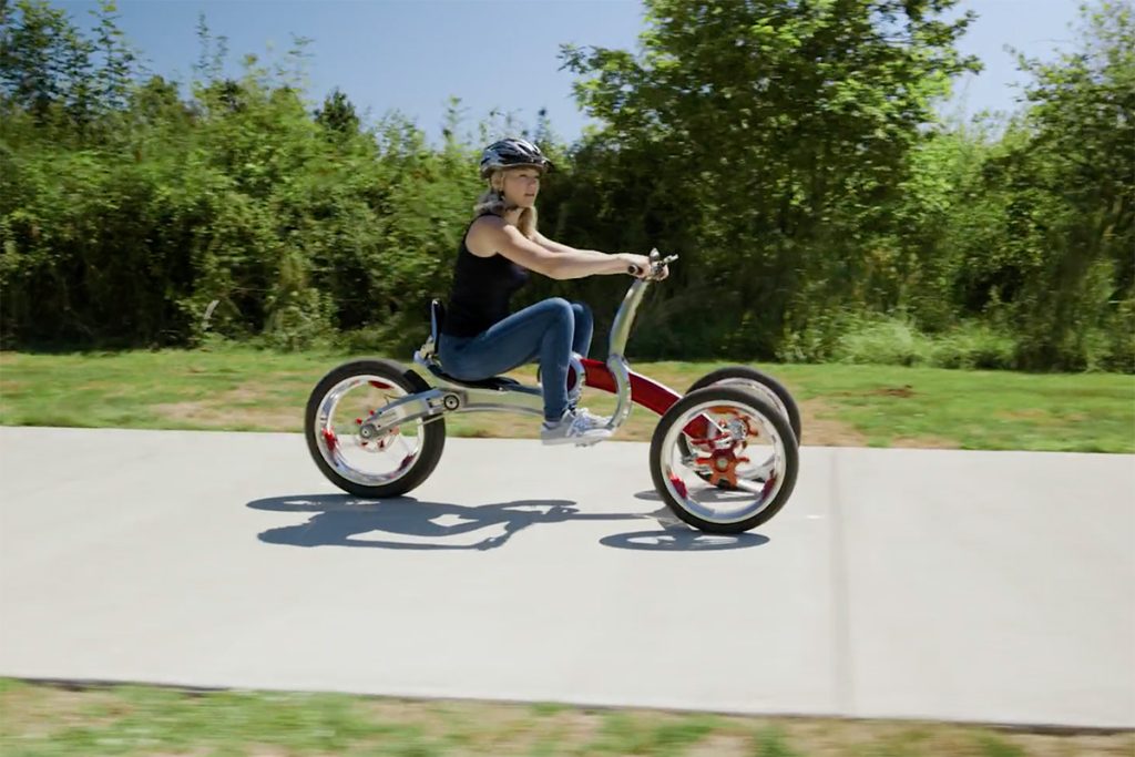Three-wheeled mobility device with pump-action system lets you ride in ...
