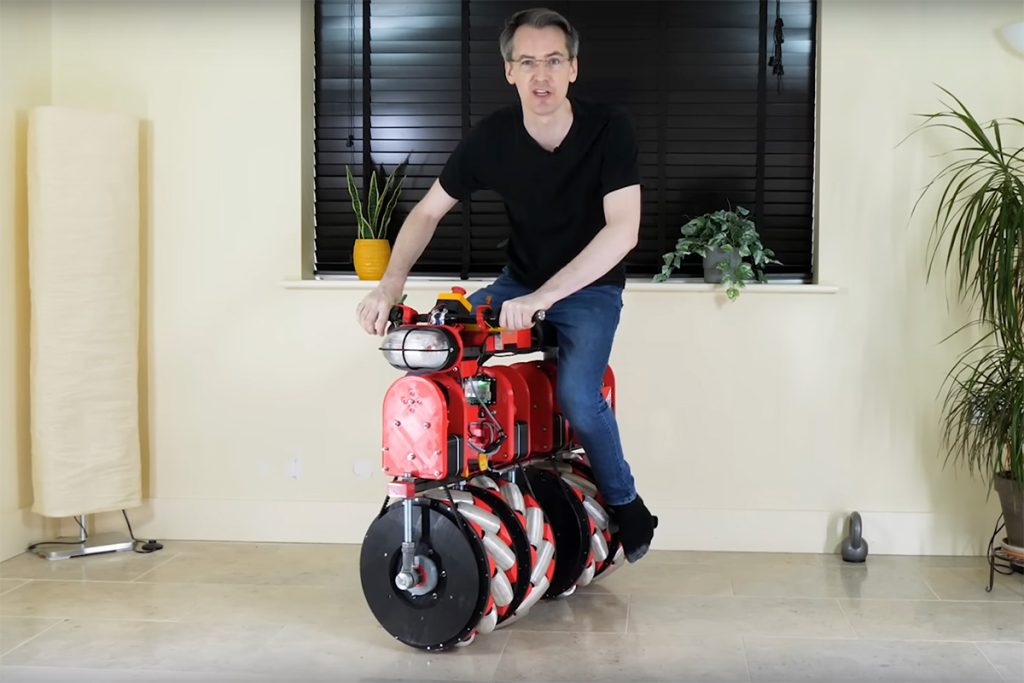 Self-balancing motorcycle rolls on four custom-made omnidirectional wheels