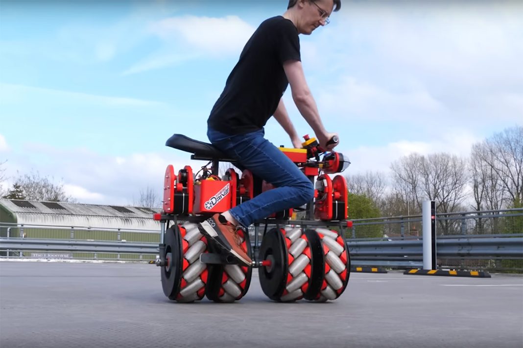 Self-balancing motorcycle rolls on four custom-made omnidirectional wheels