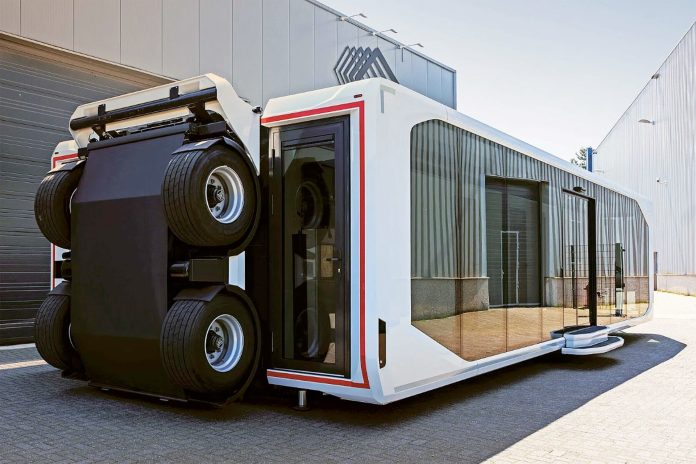 Mobile unit transports like a trailer, docks flat for ground-level ...