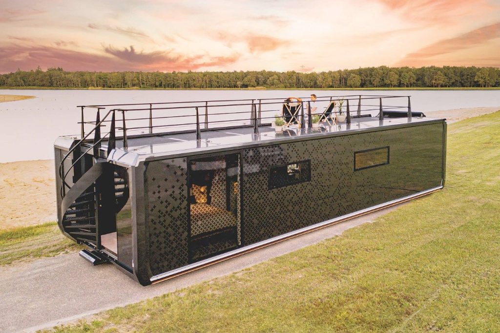Mobile unit transports like a trailer, docks flat for ground-level ...