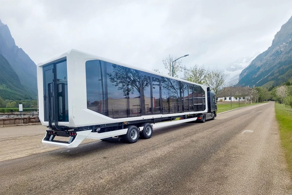 Mobile unit transports like a trailer, docks flat for ground-level ...