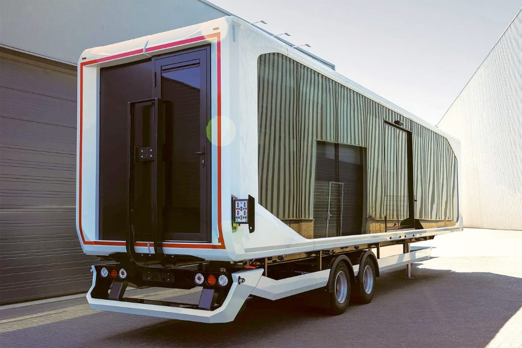 Mobile unit transports like a trailer, docks flat for ground-level ...