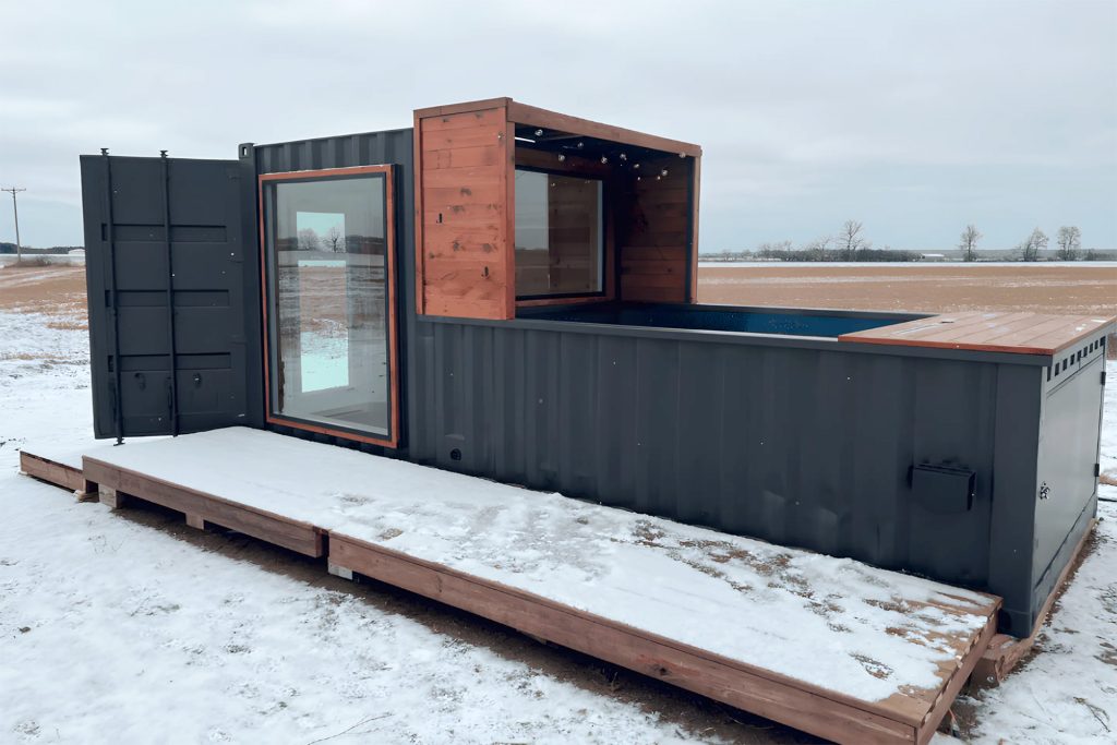 Shipping container-based sauna and plunge pool designed for backyards