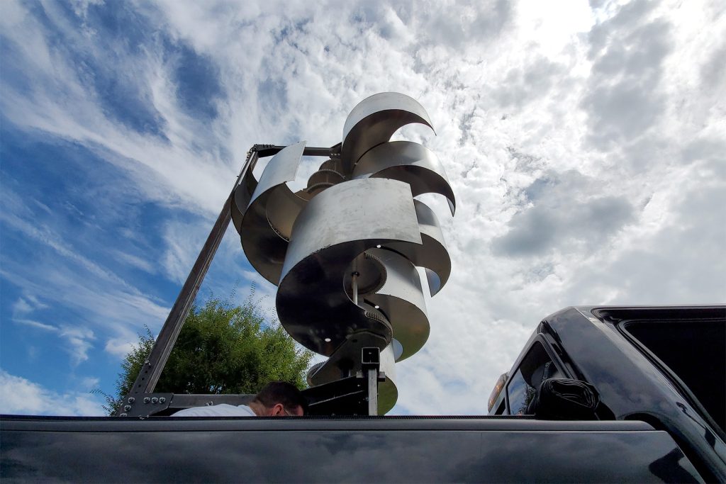 Vertical axis wind turbine with unique furling mechanism for high-wind ...