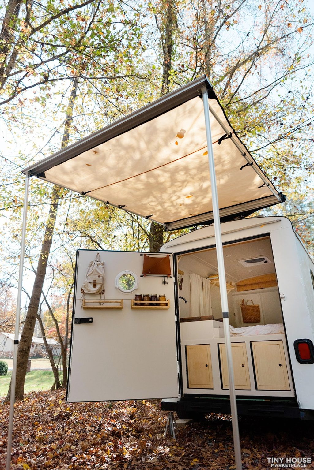 Old cargo trailer transformed into a compact tiny house on wheels