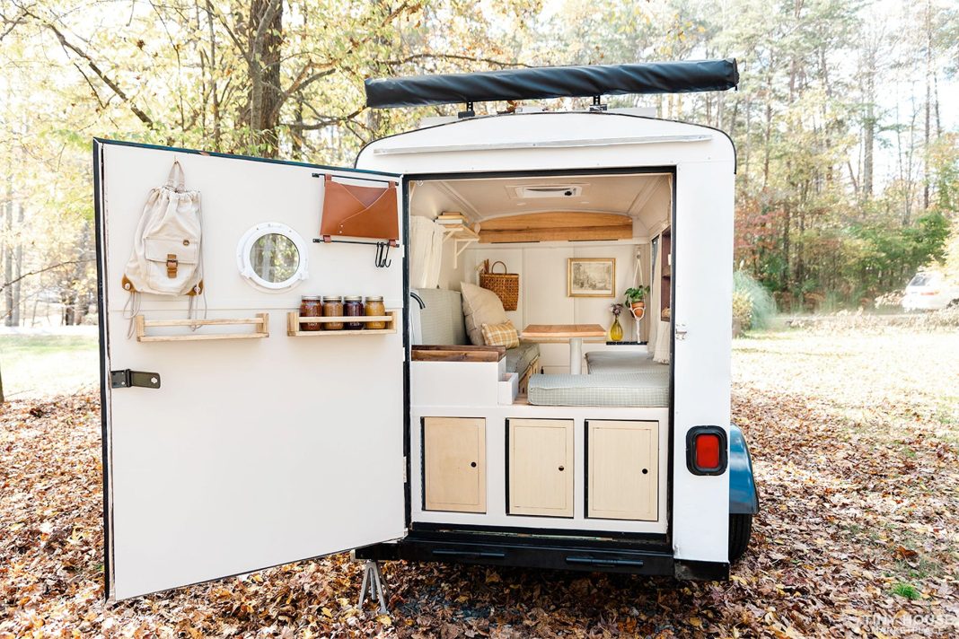 Old cargo trailer transformed into a compact tiny house on wheels